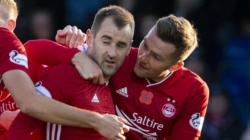 Michael Devlin is accidentally slapped in the face as Aberdeen ...