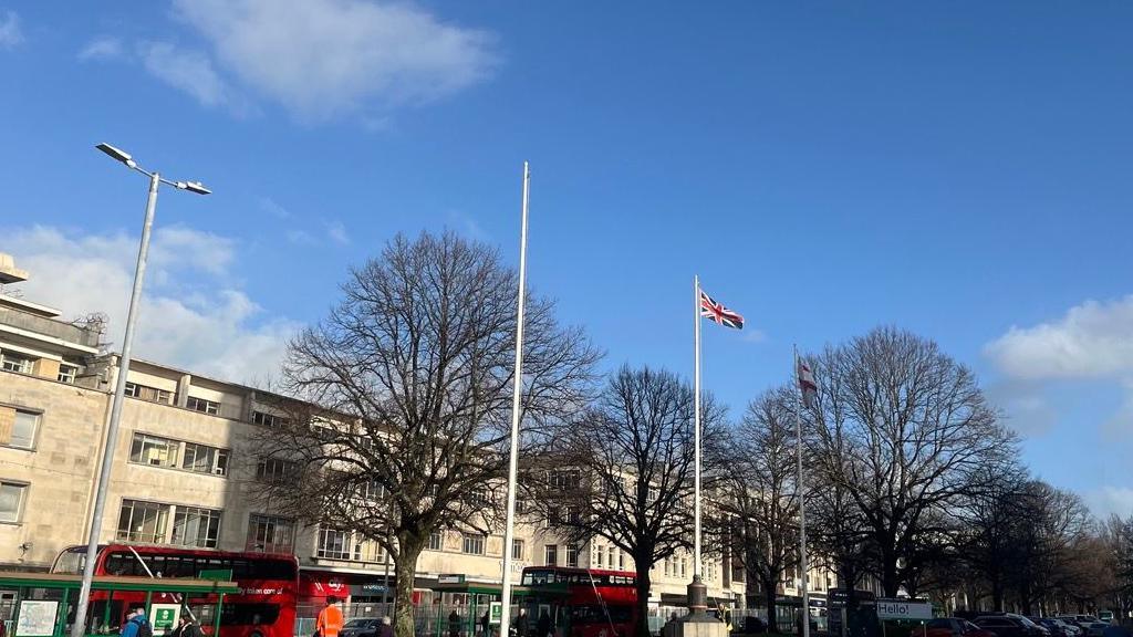 Flag removal halted in Exeter amid safety concerns - BBC News