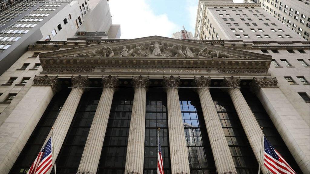 Wall Street treads water despite tariff row - BBC News