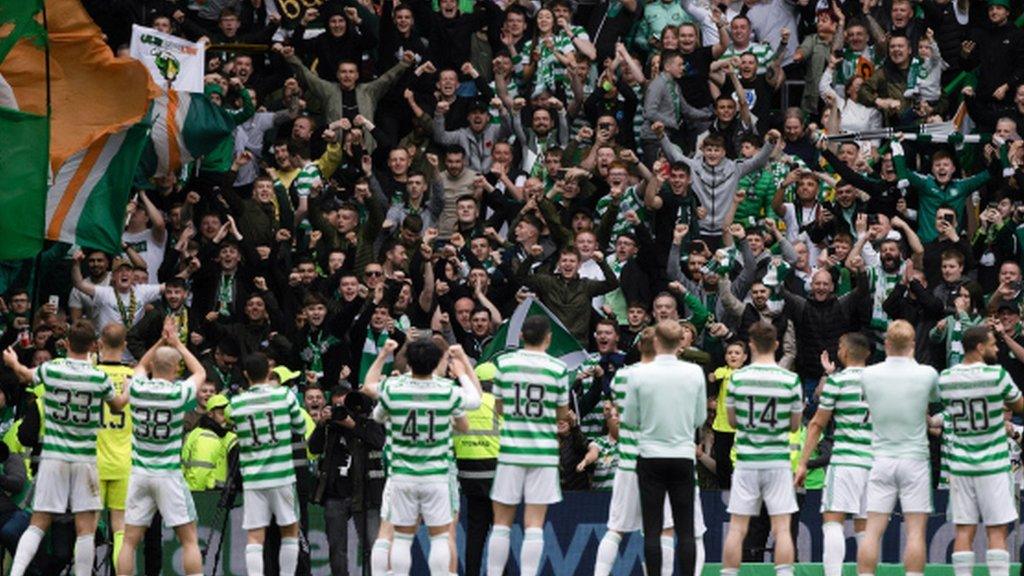 Celtic players and staff celebrate all but winning the Scottish ...