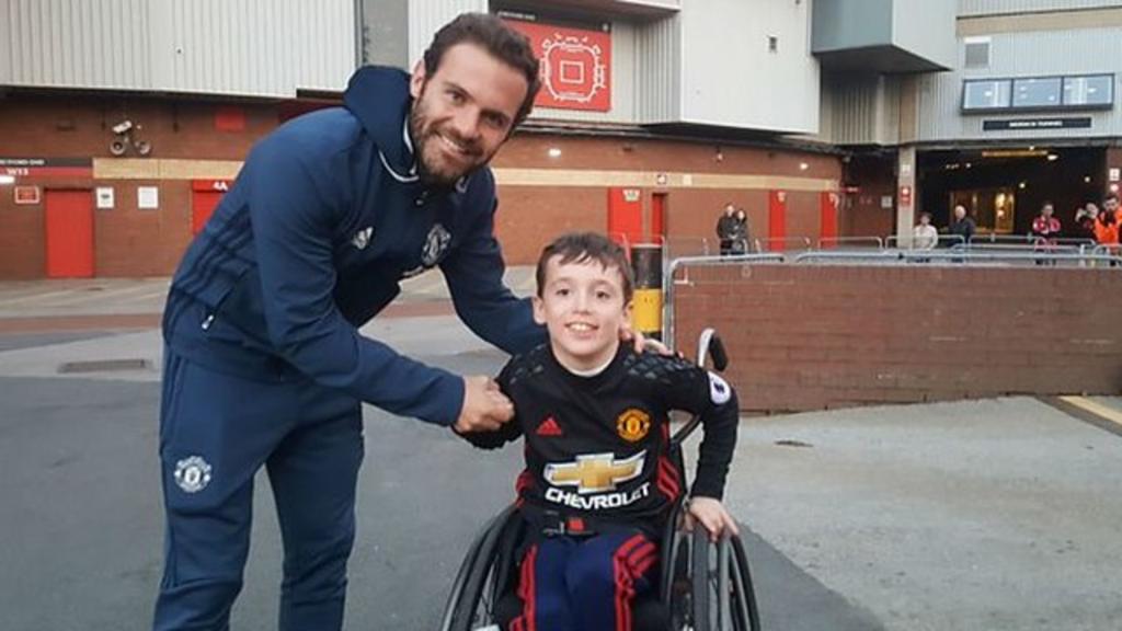 Manchester United star Juan Mata greets nine-year-old Alex Nield ...