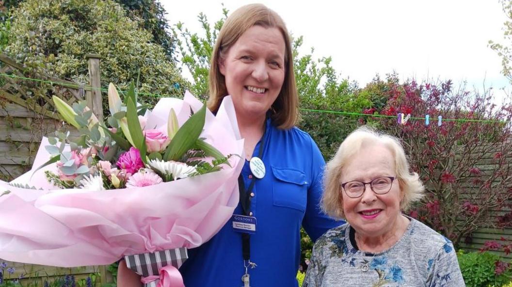 Portrush: Pharmacy worker retires after 75 years in her first job - BBC ...