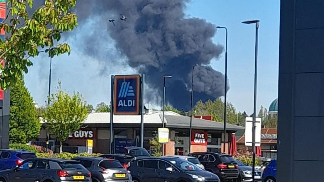 Large fire breaks out in Trafford with black smoke seen for miles - BBC ...