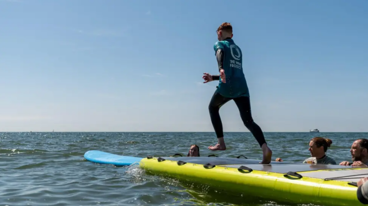 Surf therapy charity begun in Cornwall hails record year of help - BBC News