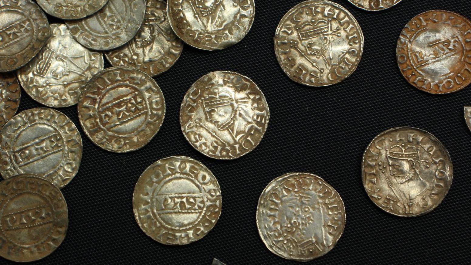 Viking soldier's gold coin pendant found in Norfolk field - BBC News
