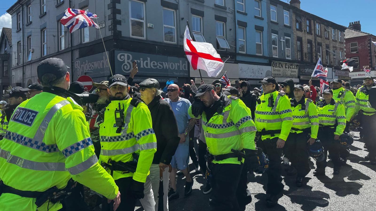 Liverpool anti-immigration march results in eight arrests - BBC News