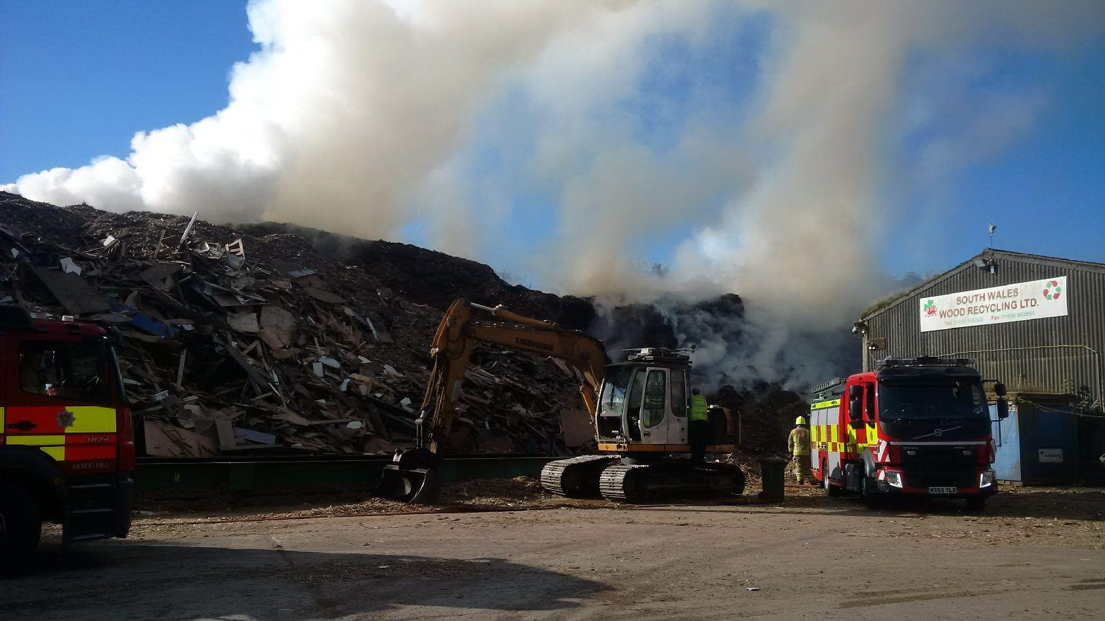 Coity woodchip fire at waste plant in Bridgend ongoing - BBC News