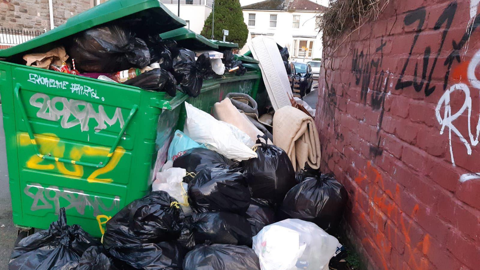 Overflowing communal bins creating a 'green slum' in St Pauls - BBC News