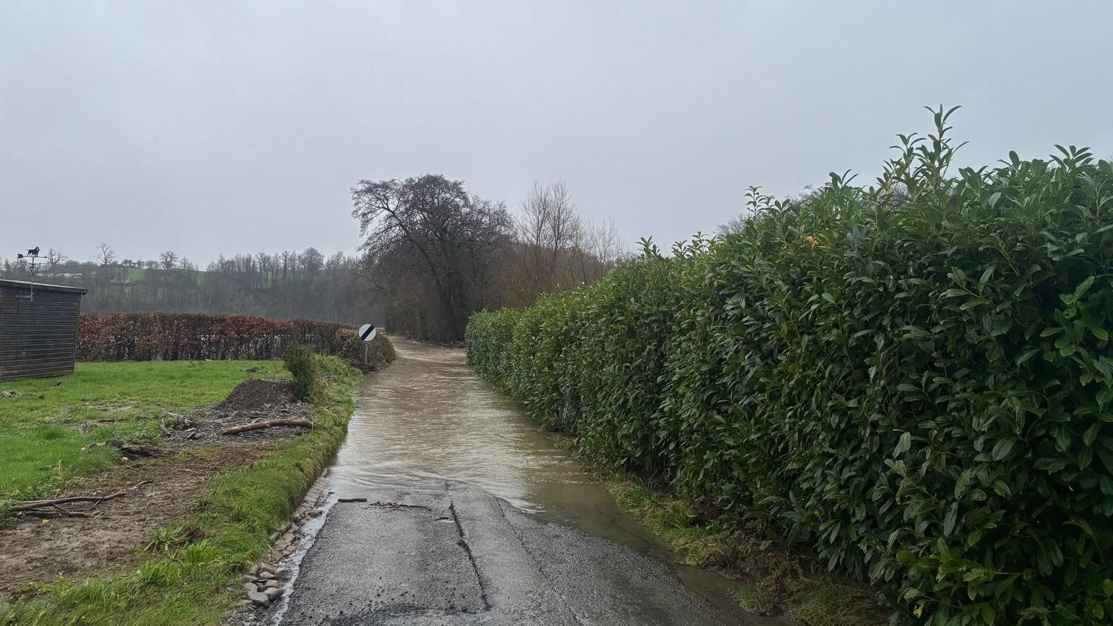 Wales travel disruption and flooding ease after heavy rain - BBC News