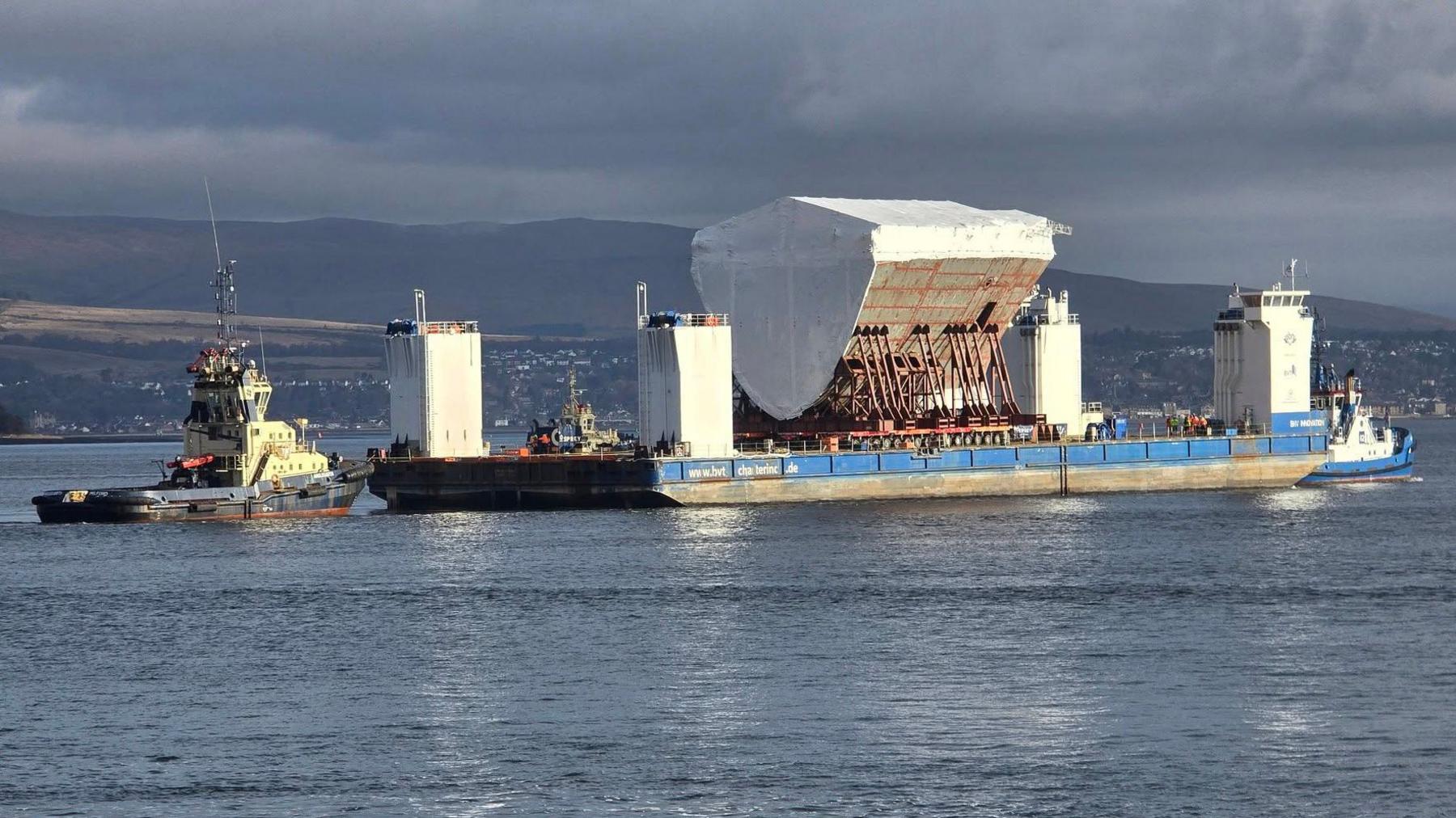 Bow section of latest Type 26 frigate sails up the Clyde - BBC News