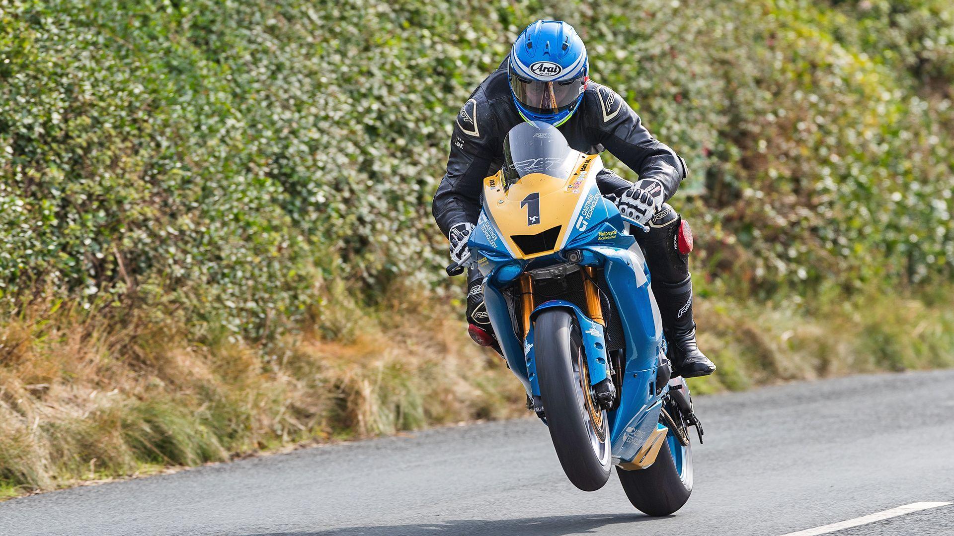 TT rider's wife seeks help to keep 'memory alive for children' - BBC News