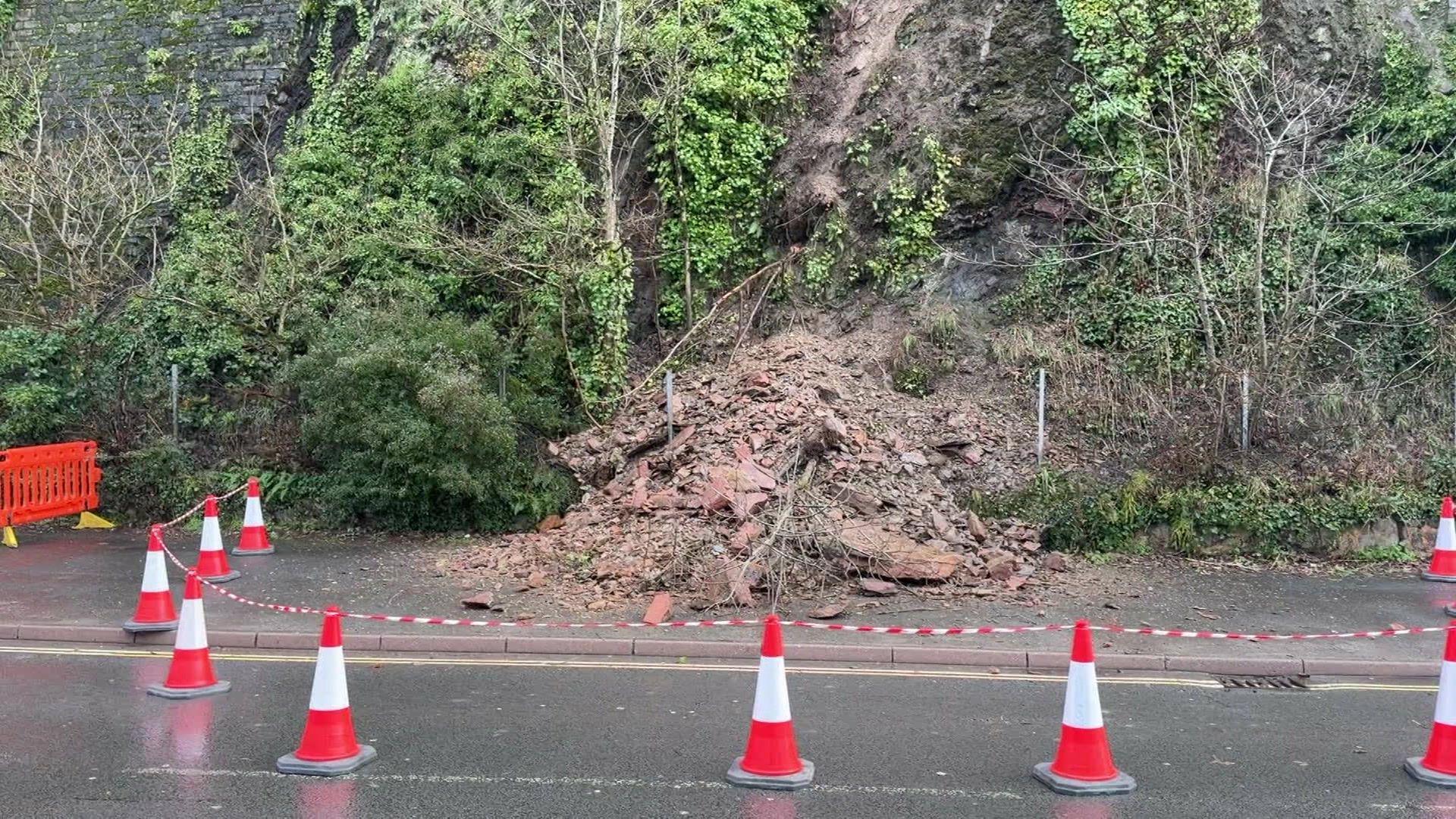 Major road closed after landslip in Exeter - BBC News