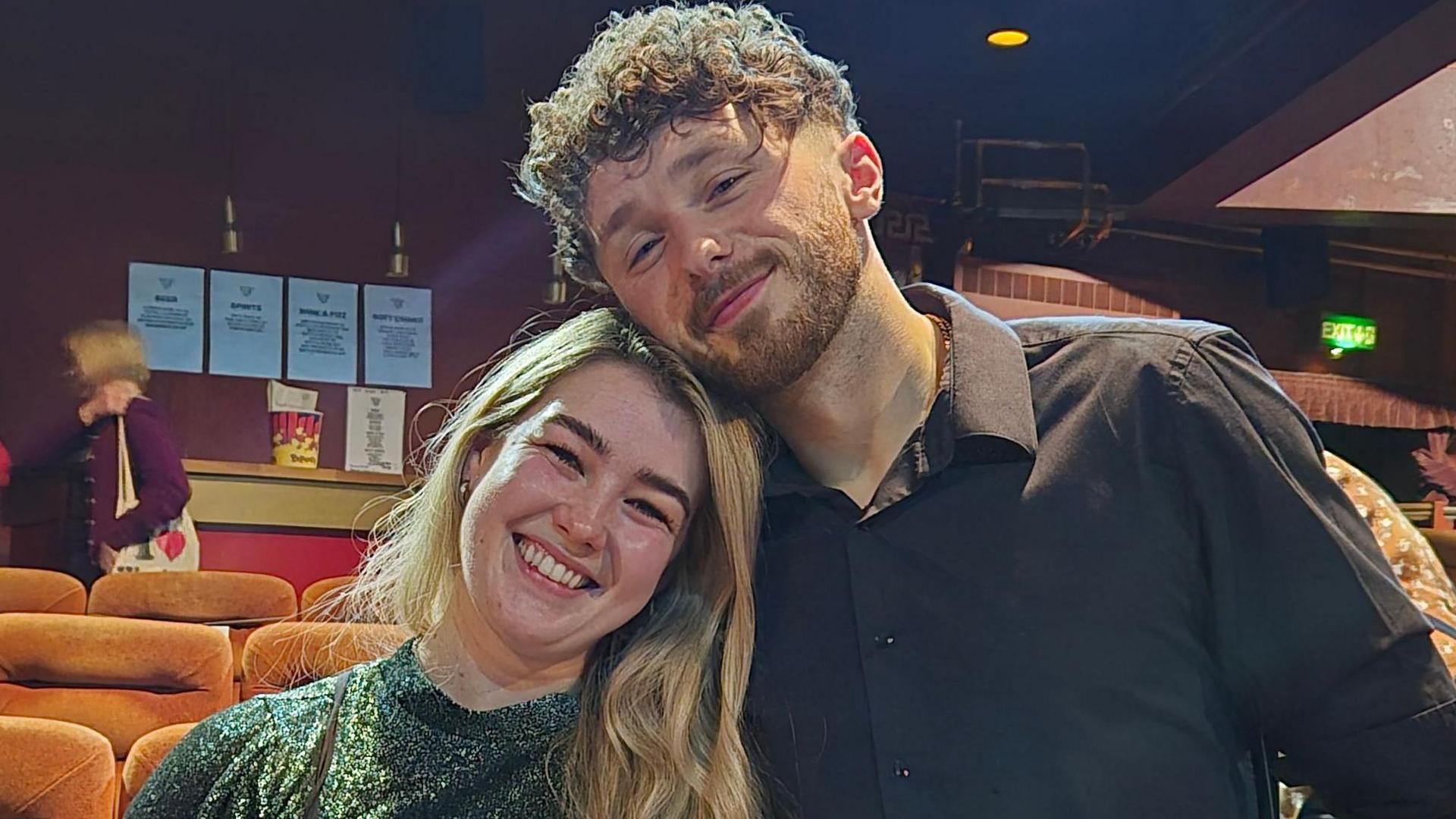 Couple's Christmas Love Actually-style Woolton Cinema proposal - BBC News