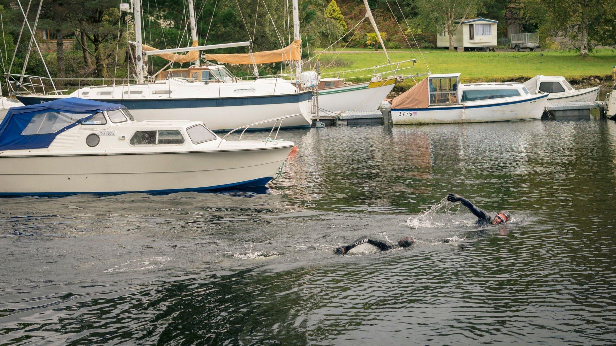 Cold feat: Pair swim coast-to-coast across Scotland - BBC News