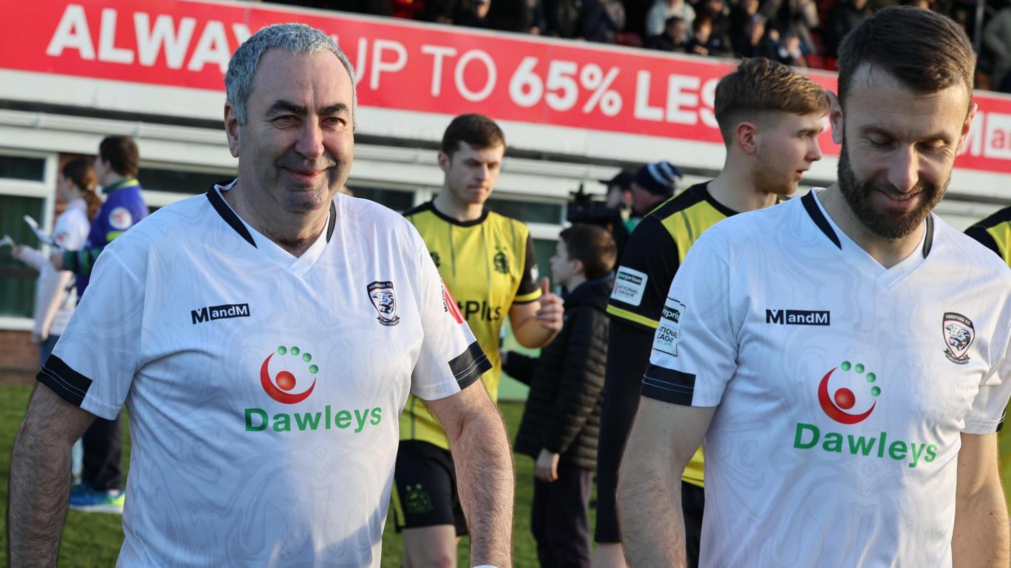 Mascot surprise for birthday boy's 60th at Hereford FC - BBC News
