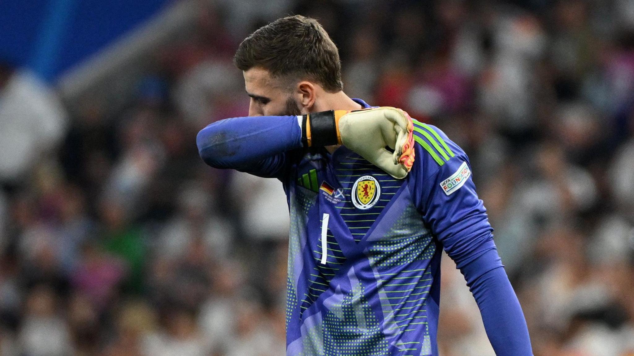 Scotland keeper Angus Gunn eager to repay fans for Munich mauling - BBC ...