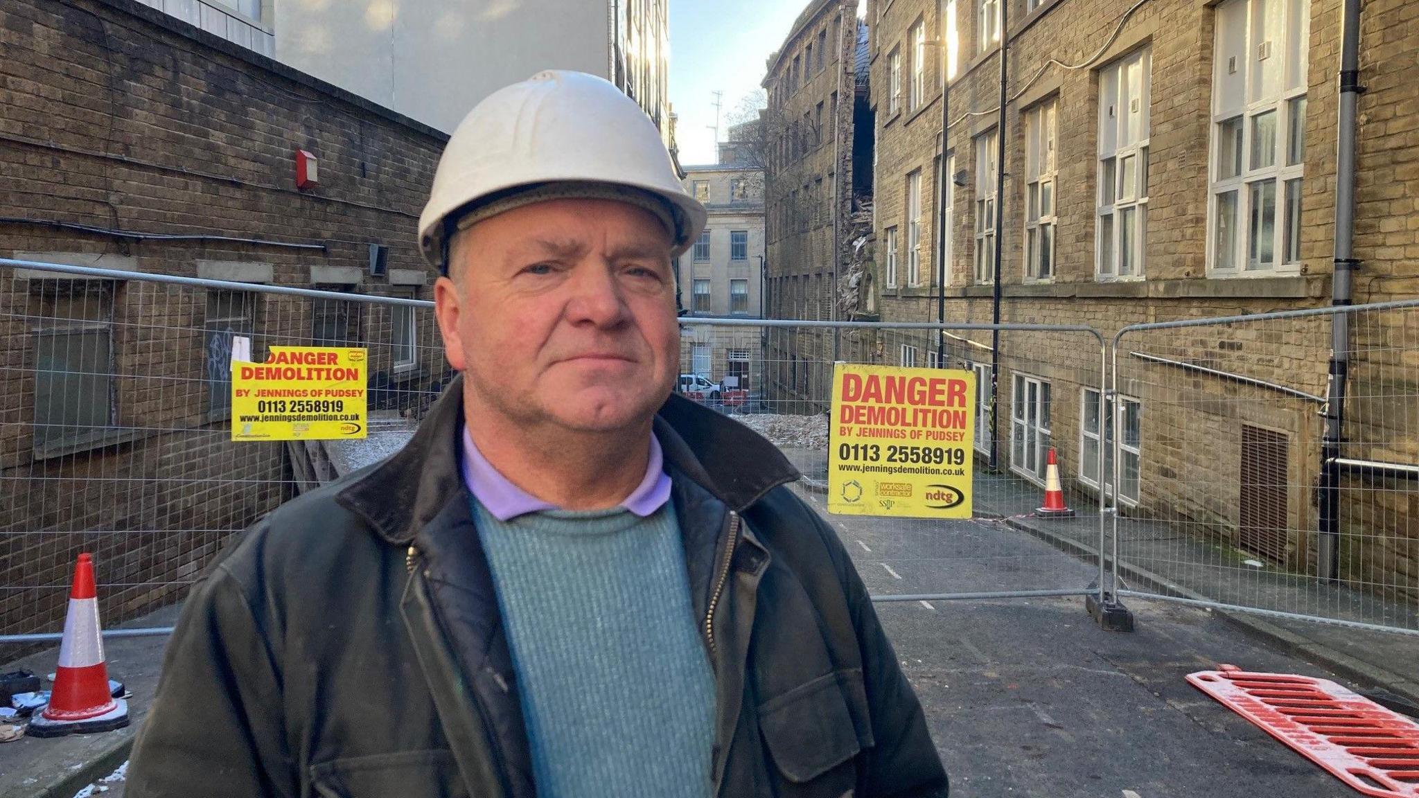 Giant excavator will 'nibble' away at unsafe Bradford building - BBC News