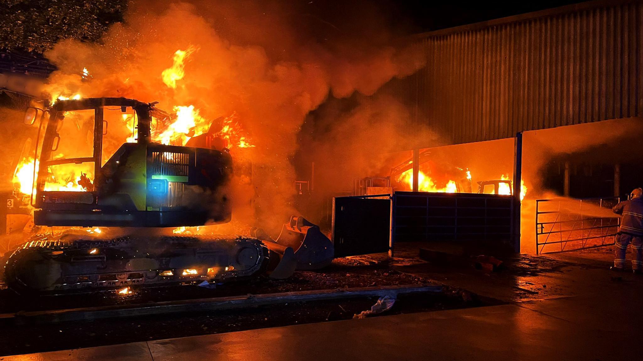 Diggers and dumper truck damaged in Market Drayton farm fire - BBC News