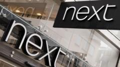 Next shop workers win equal pay claim - BBC News