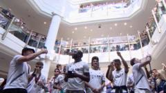 Bromley FC celebrate historic promotion with bus tour - BBC News