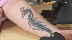 Tattoos as a way of tackling insecurities and camouflaging scars - BBC News