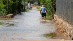 Torrential rain in Spain causes major flooding - BBC News