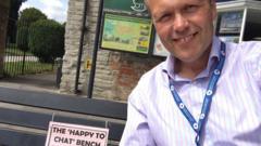'Happy to Chat' benches: The woman getting strangers to talk - BBC News