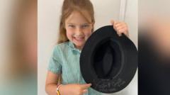 Taylor Swift: Seven-year-old gets singer's famous 22 hat - BBC News
