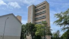 Man, 33, arrested in tower block murder probe - BBC News
