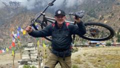 Henfield: Neil Laughton completes altitude cycling record bid - BBC News