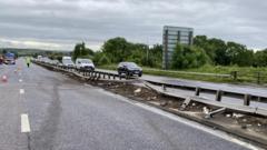 Major delays after lorry crashes into M66 barrier - BBC News