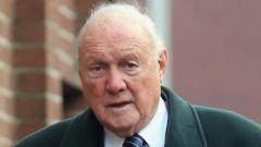 Stuart Hall released from prison halfway through sentence - BBC News
