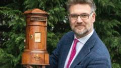 First King Charles post box unveiled in Great Cambourne - BBC News
