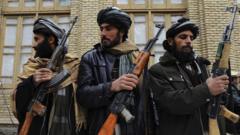 The Afghan district stuck between IS and the Taliban - BBC News