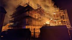 Peterborough fire hits homes under construction - BBC News