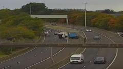 Lorry driver dies as load smashes onto M8 motorway from bridge - BBC News