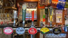 Cost of living: Pub halves beer and cider choice to survive - BBC News
