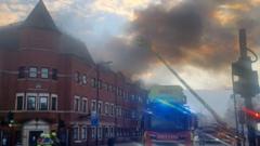 Newham police station fire: No date yet for reopening of road - BBC News