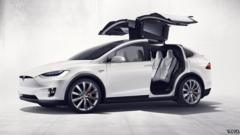 Tesla unveils Model X car with Falcon Wing doors - BBC News