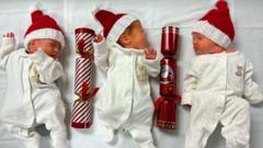 Rare identical triplets make it home for Christmas - BBC News