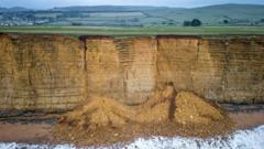 Cliff fall danger warning after 'huge' collapse at Seatown - BBC News
