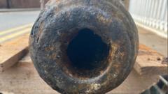 Magnet fishermen pull cannon from River Don in Sheffield - BBC News