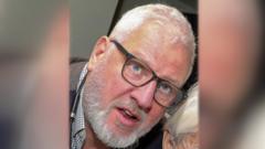 Ted Baker founder Ray Kelvin resigns amid 'forced hugging' row - BBC News