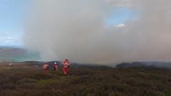 Fire crews tackle re-ignited Meltham moorland blaze - BBC News