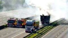 M3 closed eastbound after electric waste fire in lorry trailer - BBC News