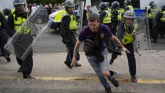 Three arrested in Barnsley town centre after rival groups clash - BBC News