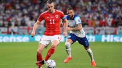 Football commentator Tony Jones retires after 50-year career - BBC News