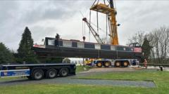 Major operation lifts boats stranded by canal collapse - BBC News