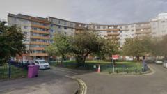 Motherwell tower blocks demolished in controlled explosion - BBC News
