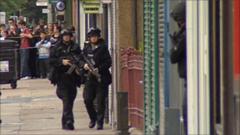 Man arrested after Glasgow 'grenade siege' - BBC News